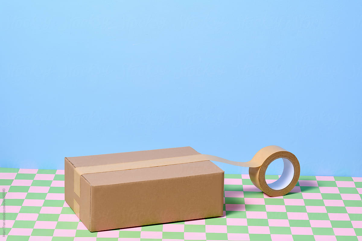 "Cardboard Box With Tape On Colorful Checkered Background" by Stocksy ...