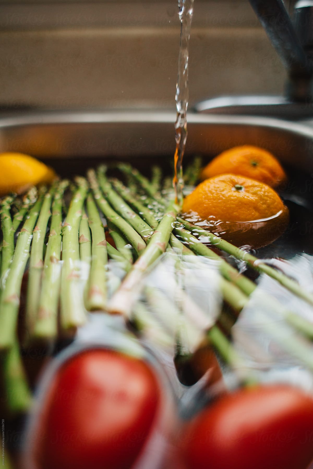 "Colorful Fruit And Vegetables Being Rinsed In Kitchen Sink At Home ...