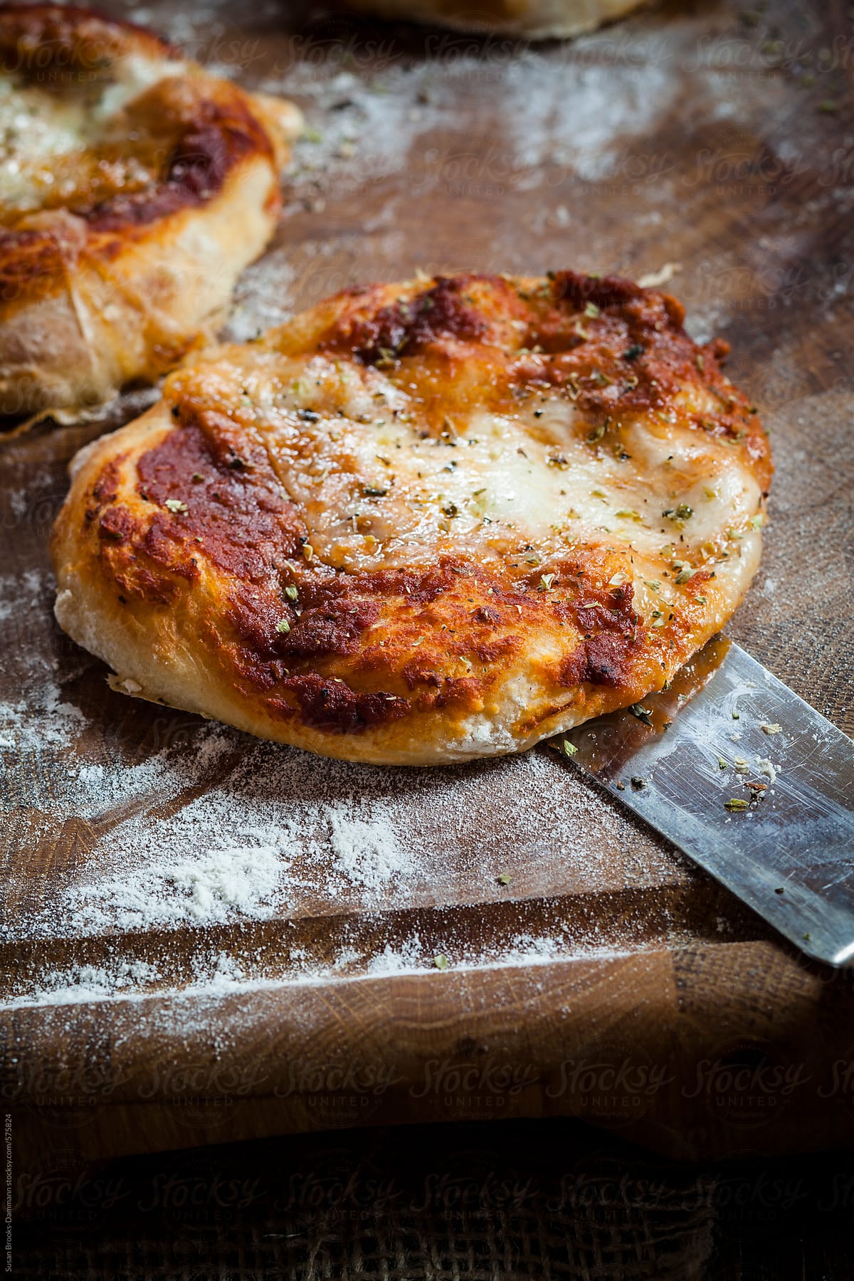 "Mini Pizza" by Stocksy Contributor "Susan Brooks-Dammann" - Stocksy