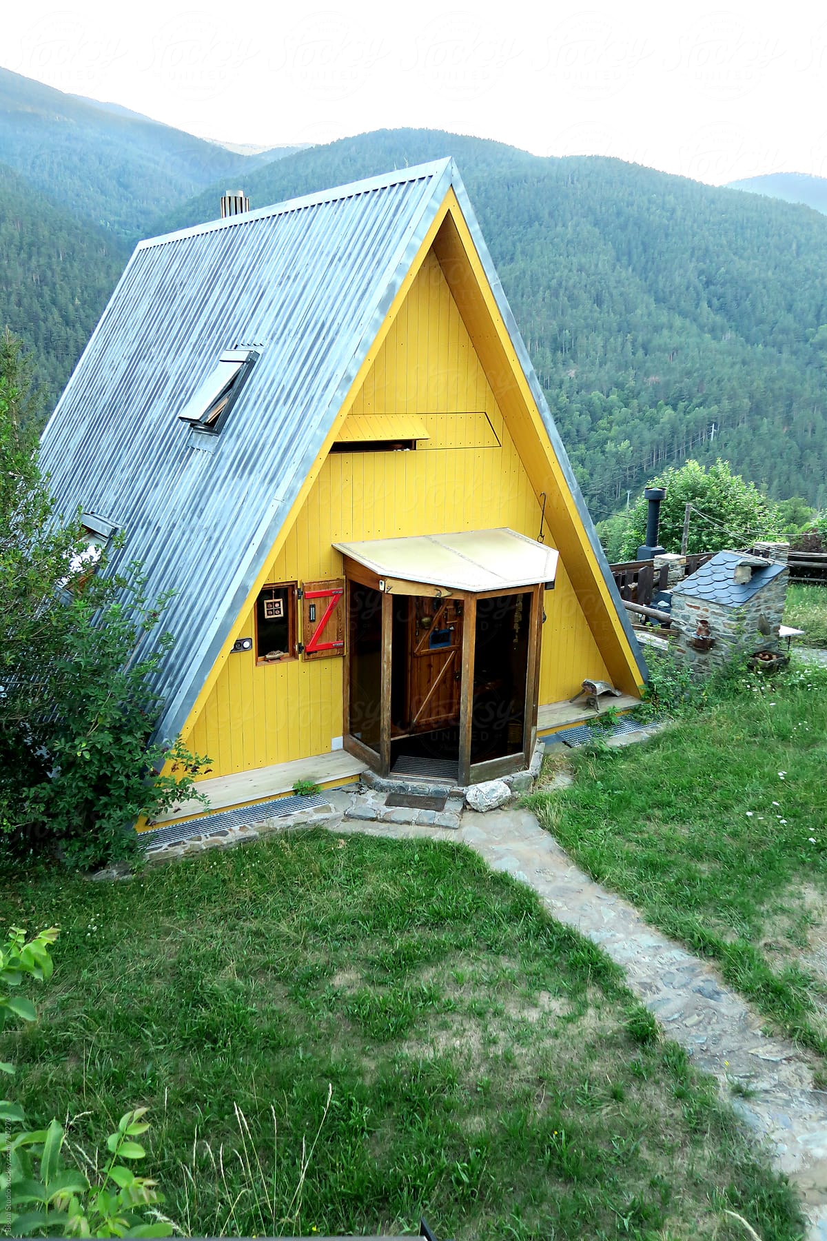 "Yellow House In The Mountains" by Stocksy Contributor "Bisual Studio ...