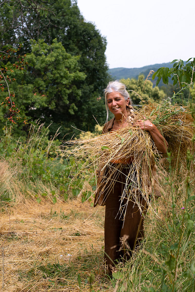 "Happy Woman Smiling On A Walk In The Countryside" by Stocksy ...