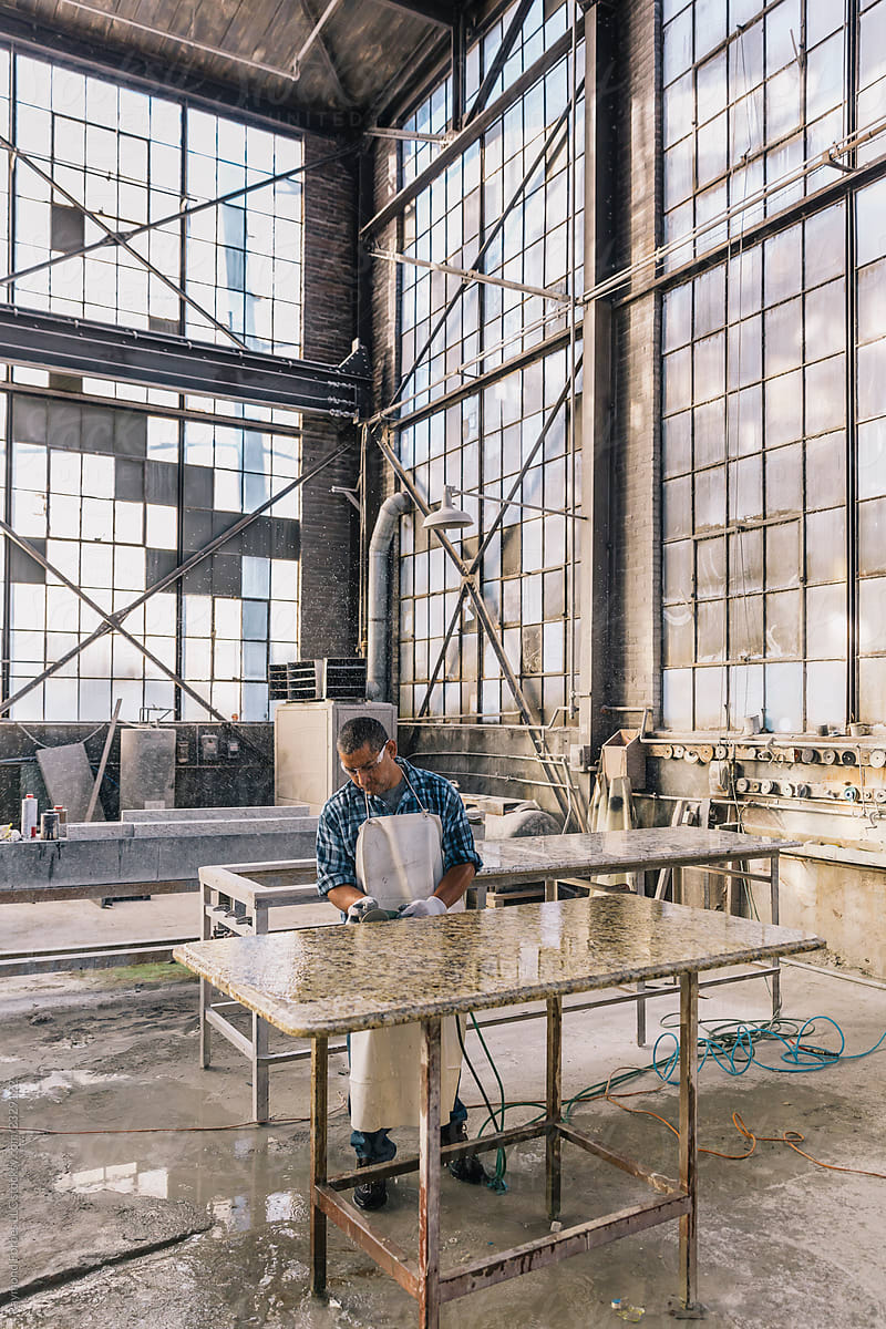 "Worker Maker Granite Countertop" by Stocksy Contributor "Raymond ...