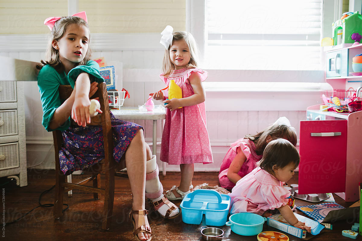 "Sisters Playing In Playroom" by Stocksy Contributor "Erin Drago" - Stocksy
