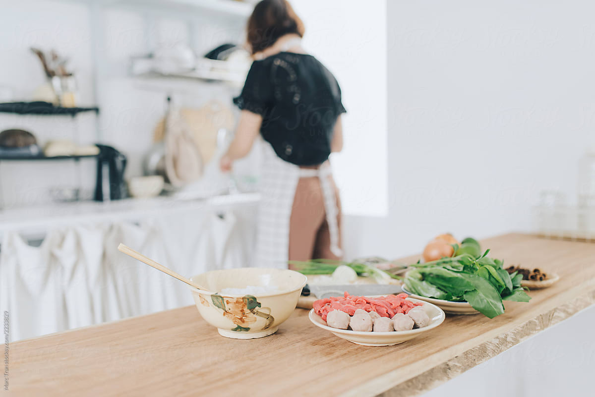"Young Vietnamese Woman Cooking." by Stocksy Contributor "Marc Tran ...