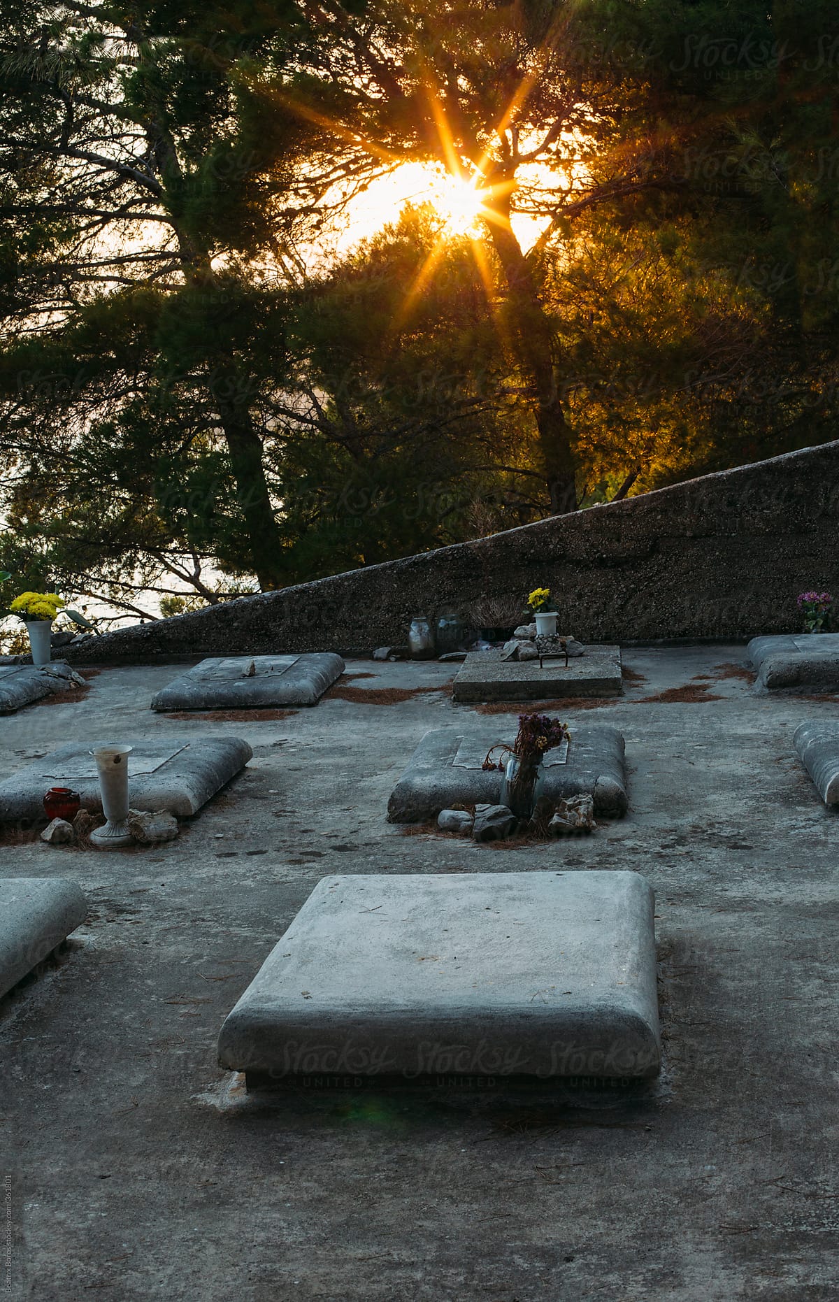 "Cemetary And Graves At Sunset With Light Beams Looking Like Heaven" by ...