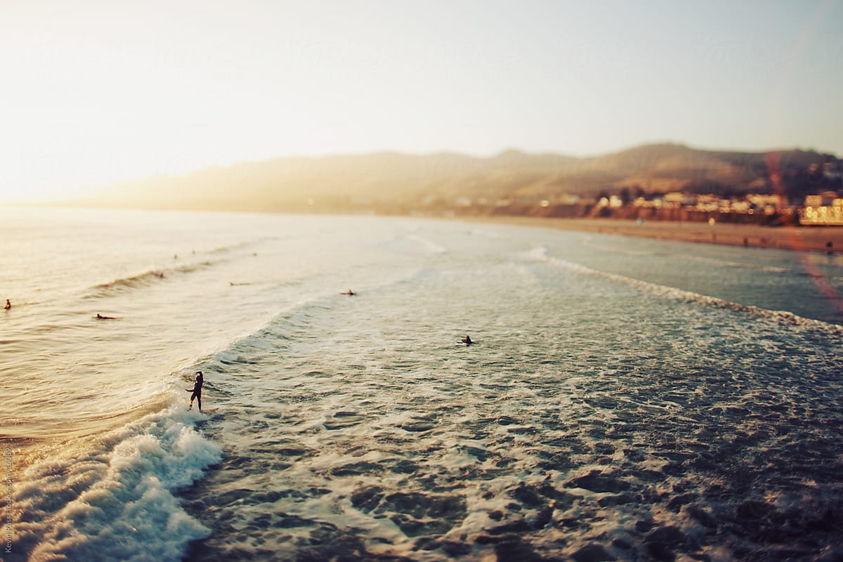"Sunset Surfers" by Stocksy Contributor "Kevin Russ" - Stocksy