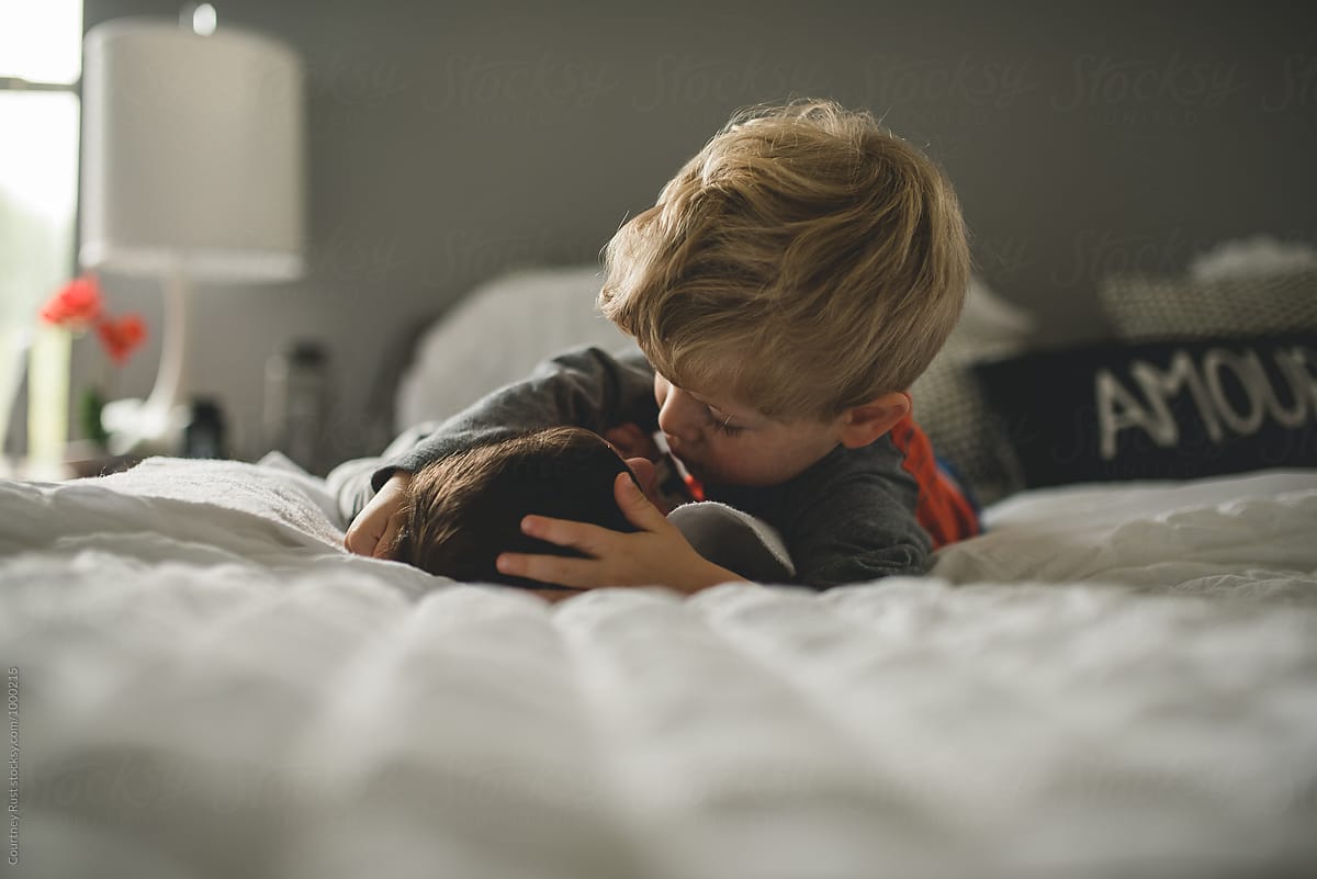 "Adoring Newborn Baby On Bed" by Stocksy Contributor "Courtney Rust ...