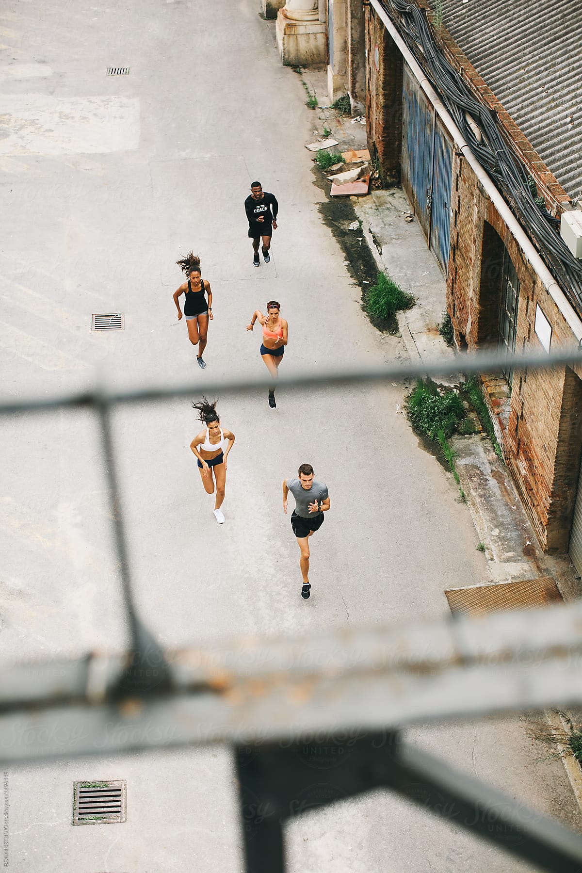 "Group Of Athletes Running On The Street From Above." by Stocksy ...