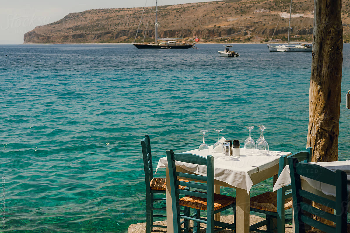 "Coastal Dining At A Seaside Restaurant Overlooking Clear Water" by ...