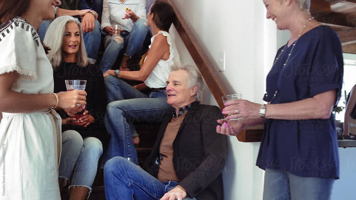 "Multigenerational Friends And Family Hanging Out On Stairs At A House ...