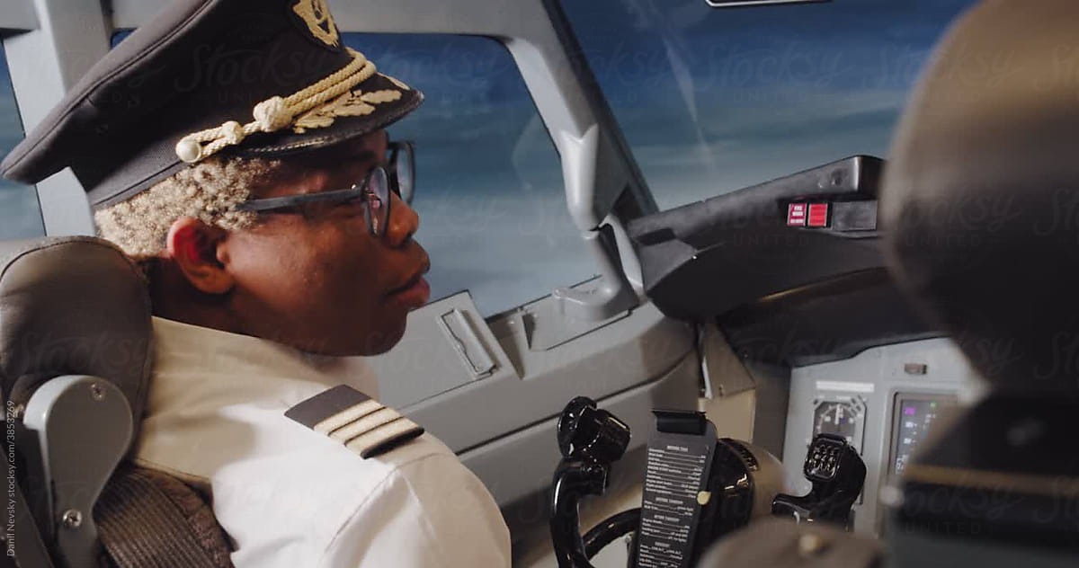 "Captain Chatting With Copilot During Flight In Airplane Cockpit" by ...