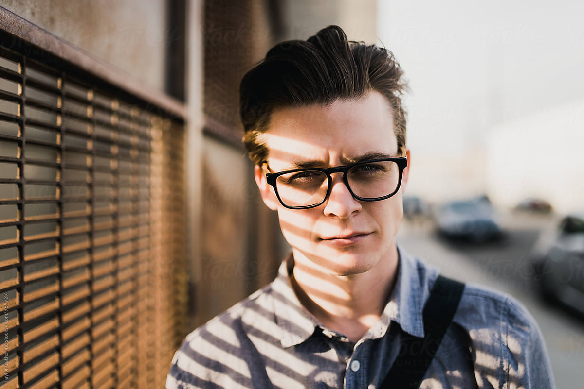 "Man Looking At Camera With Interesting Light" by Stocksy Contributor ...