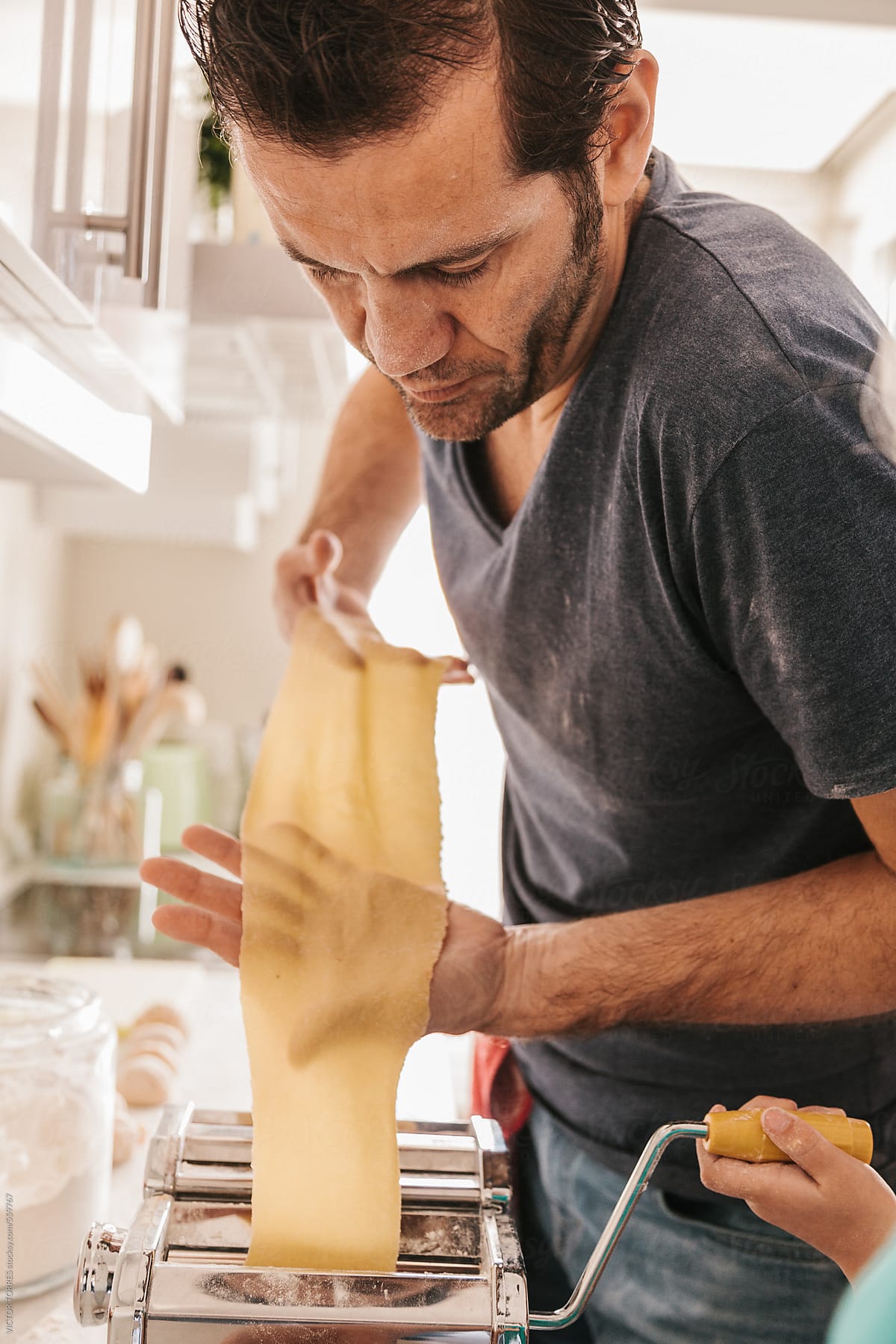 "Family Preparing Pasta At Home" by Stocksy Contributor "VICTOR TORRES ...