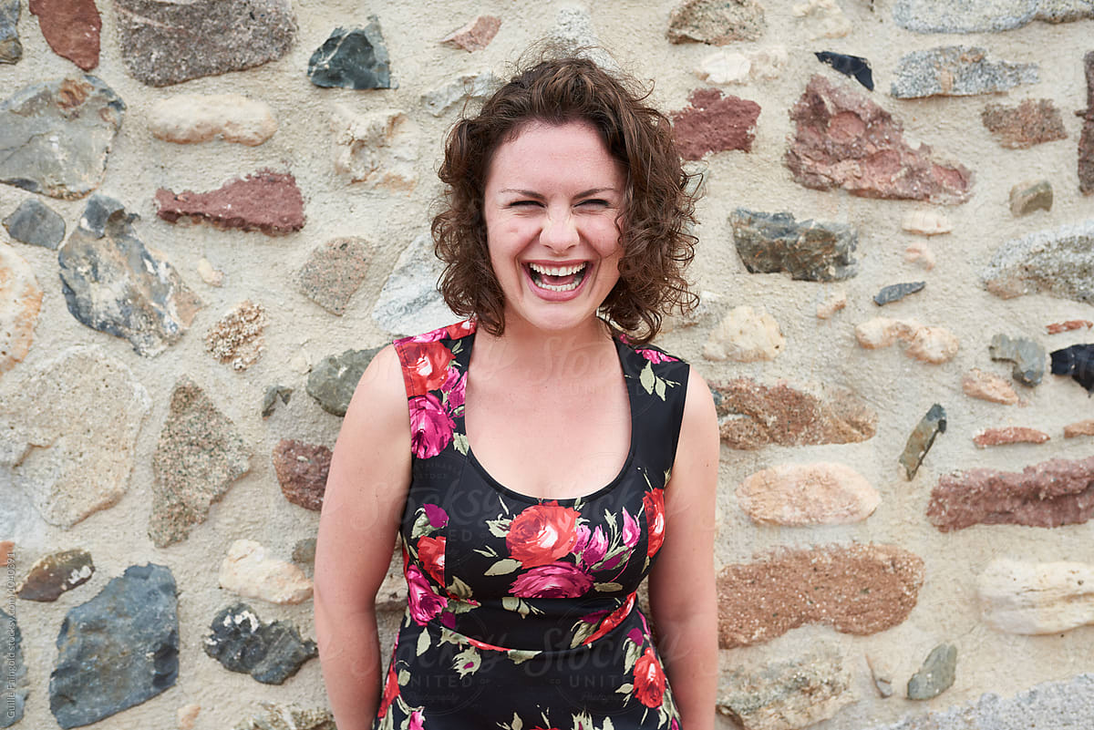 "Laughing Adult Woman" by Stocksy Contributor "Guille Faingold" - Stocksy