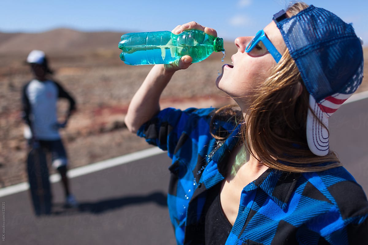 "Woman Drinking Water After Sport In The Desert" by Stocksy Contributor ...