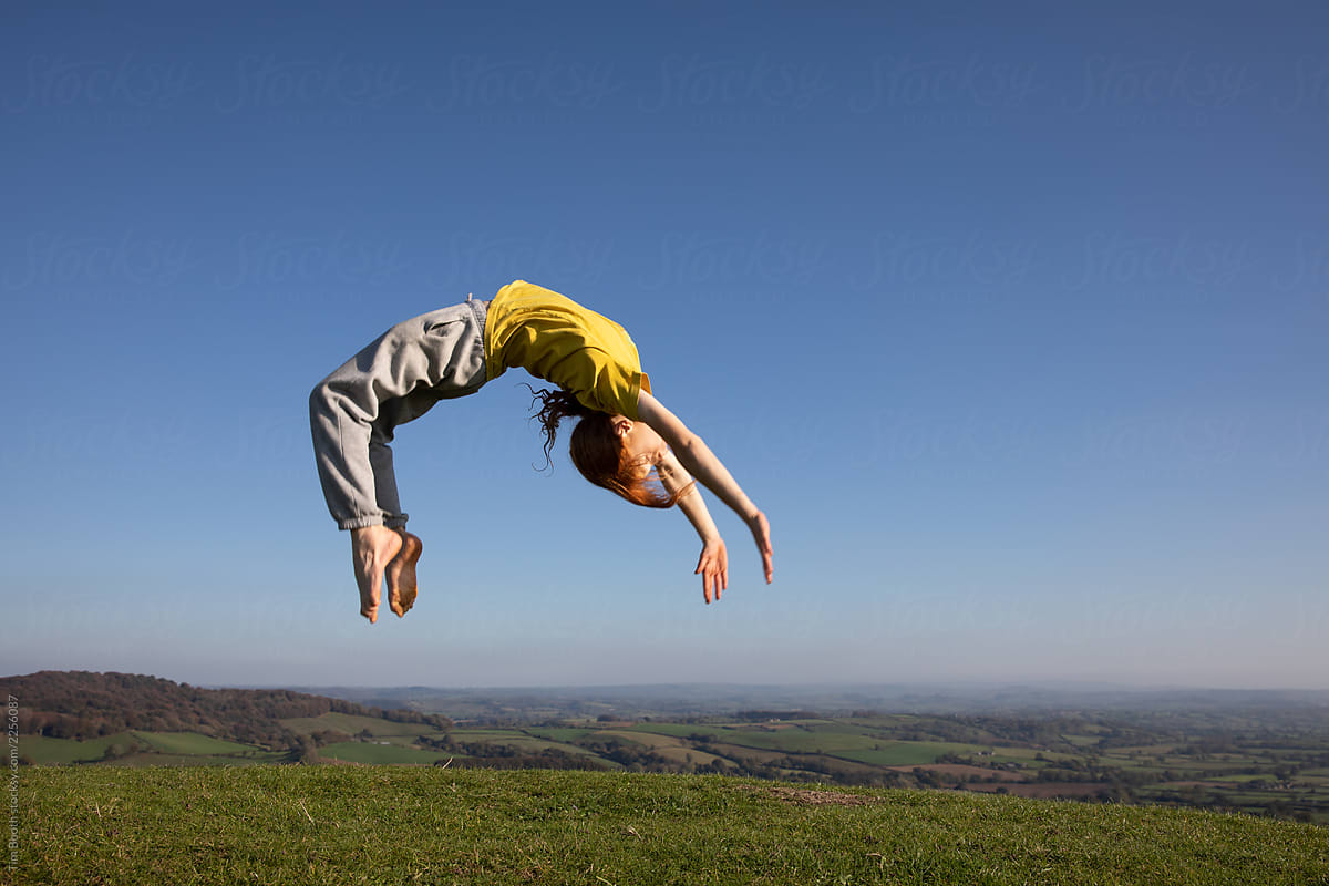 A Young Red headed Boy Performing A Backflip By Stocksy Contributor A Young Red headed Boy Performing A Backflip By Stocksy Contributor