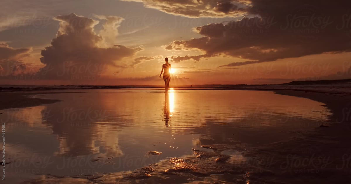"Woman Walking On Sunset Beach" by Stocksy Contributor "Maryanne Gobble ...