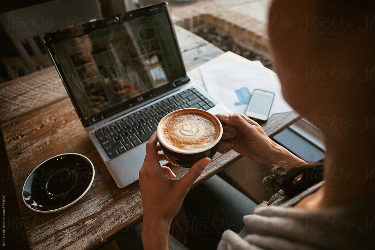 "Cafe: Woman Having Fancy Latte And Going Over Data On Laptop" by ...