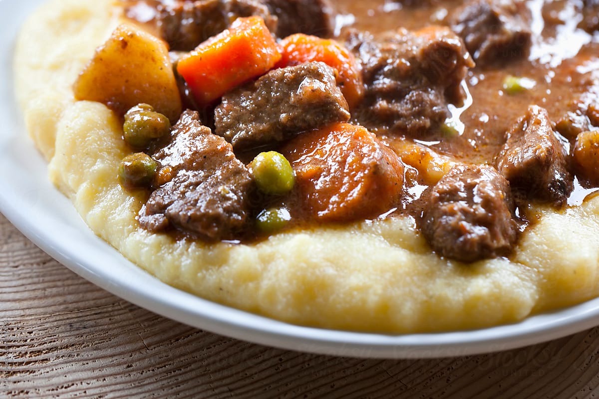 "Beef Stew On Creamy Polenta" by Stocksy Contributor "Jill Chen" - Stocksy
