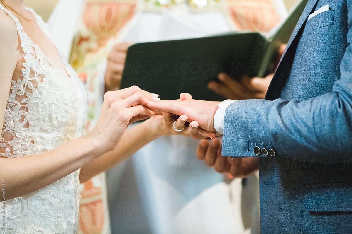 "Bride Putting On A Ring On The Groom" by Stocksy Contributor "A Model ...