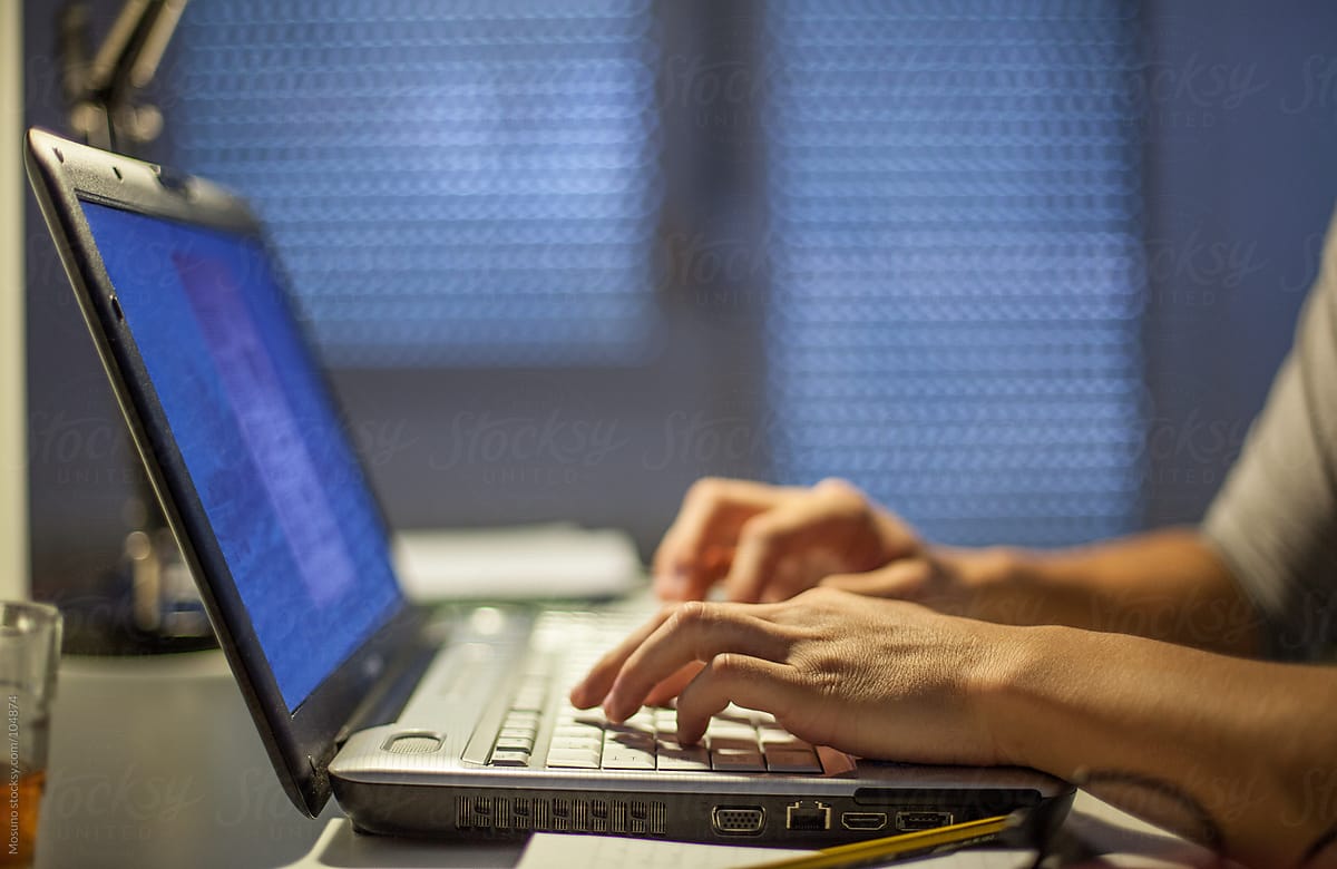 "Student Typing On Laptop" by Stocksy Contributor "Mosuno" - Stocksy
