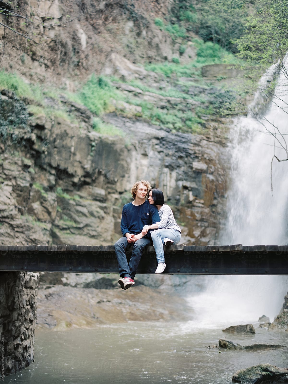 "A Couple Sitting near Waterfall" by Stocksy Contributor "Alexandr ...