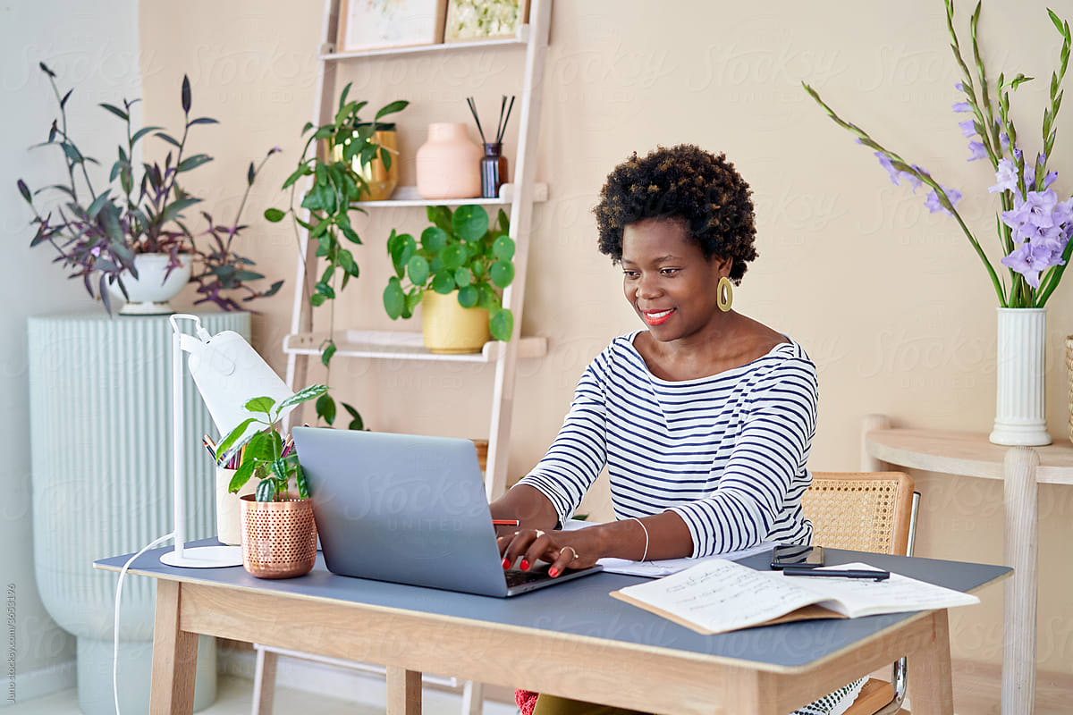 "Business Woman At Home" by Stocksy Contributor "Juno" - Stocksy
