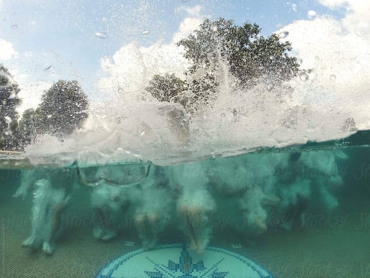 "Friends Jumping Underwater In Pool" by Stocksy Contributor "Guille ...