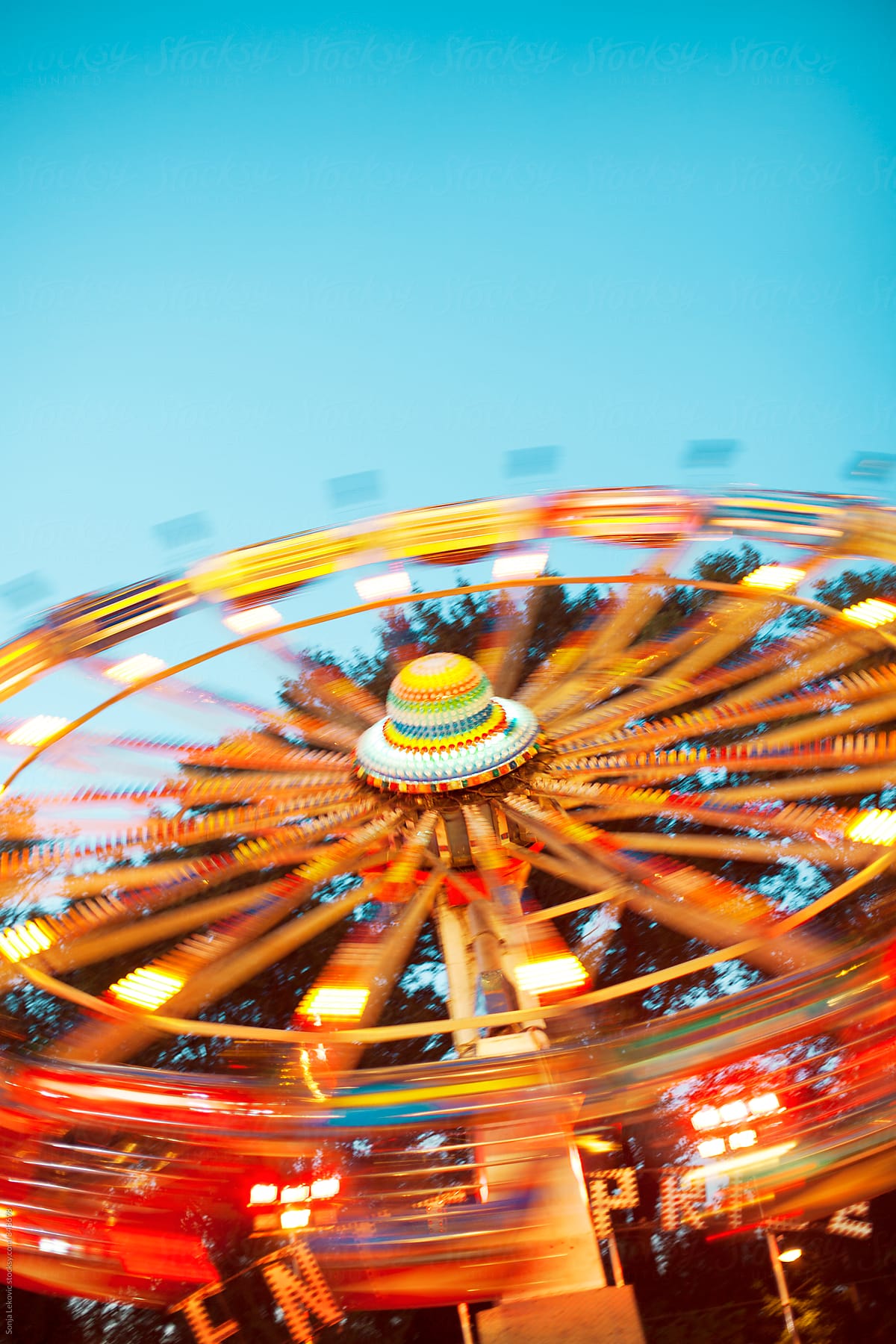 "Spinning Wheel At Amusement Park" by Stocksy Contributor "Sonja ...