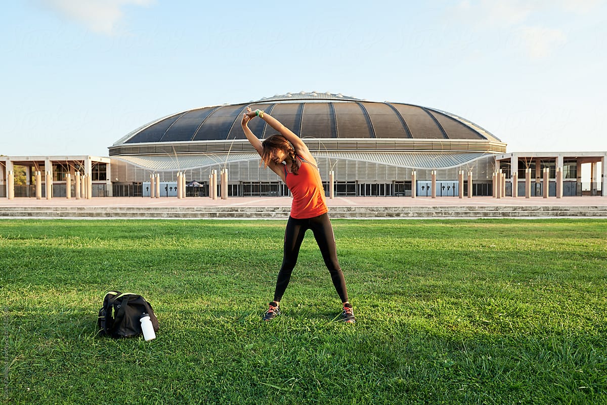 "Active Fit Woman Stretching On Lawn" by Stocksy Contributor "Guille ...