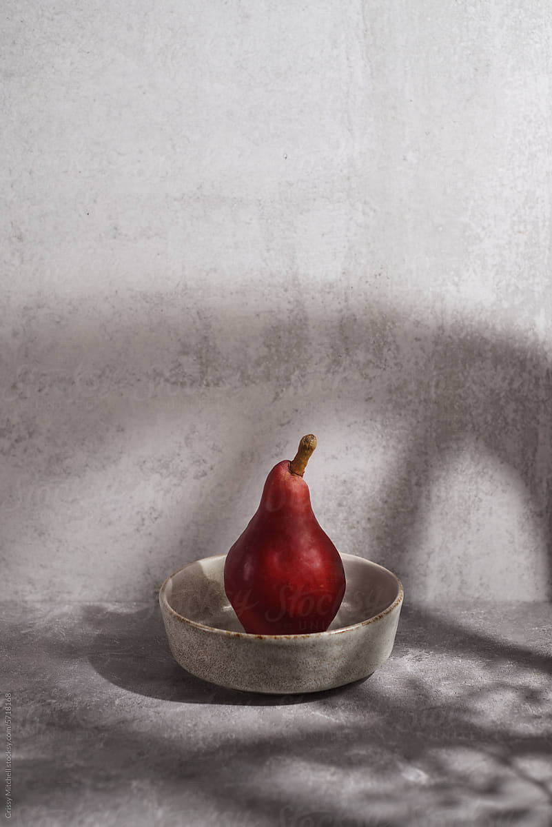 "Red Pear" by Stocksy Contributor "Crissy Mitchell" - Stocksy