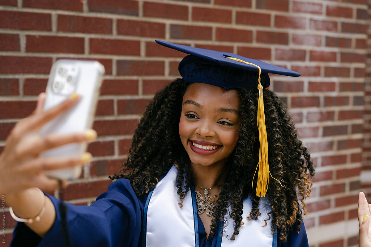 "Smiling College Graduate Taking A Selfie" by Stocksy Contributor "Lea ...