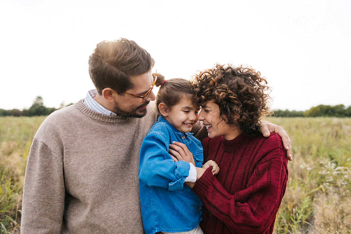 "Family Hugging" by Stocksy Contributor "Studio Firma" - Stocksy