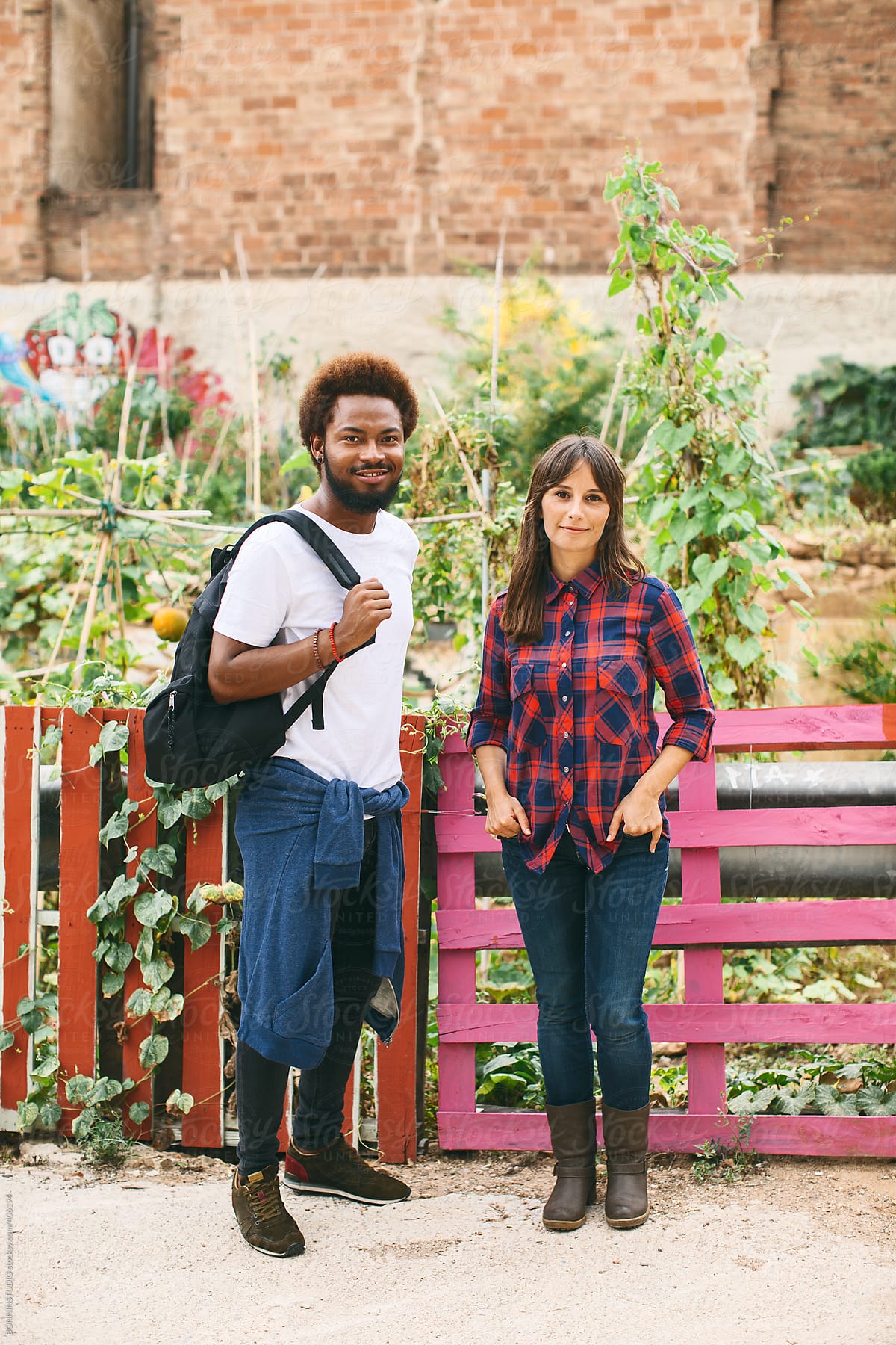 "Portrait Of Beautiful Friends In Front A Urban Garden." by Stocksy ...