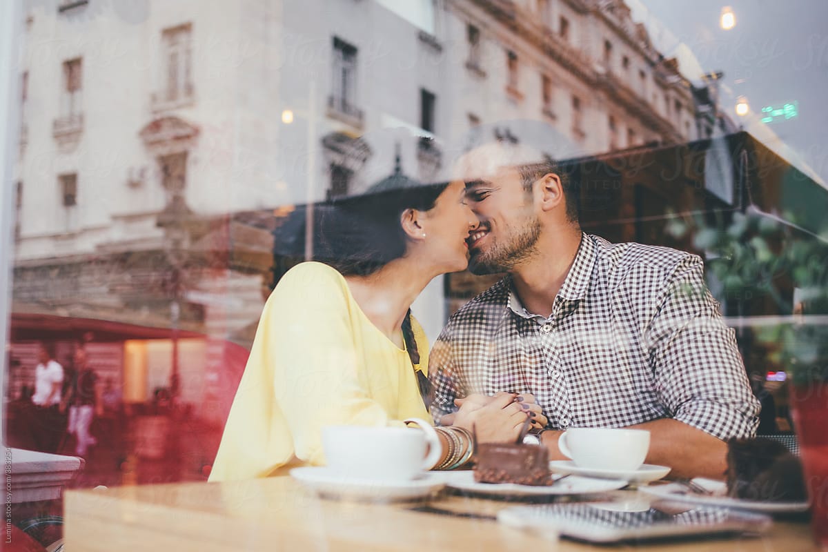 "Caucasian Couple In Love Kissing At A Cafe" by Stocksy Contributor ...
