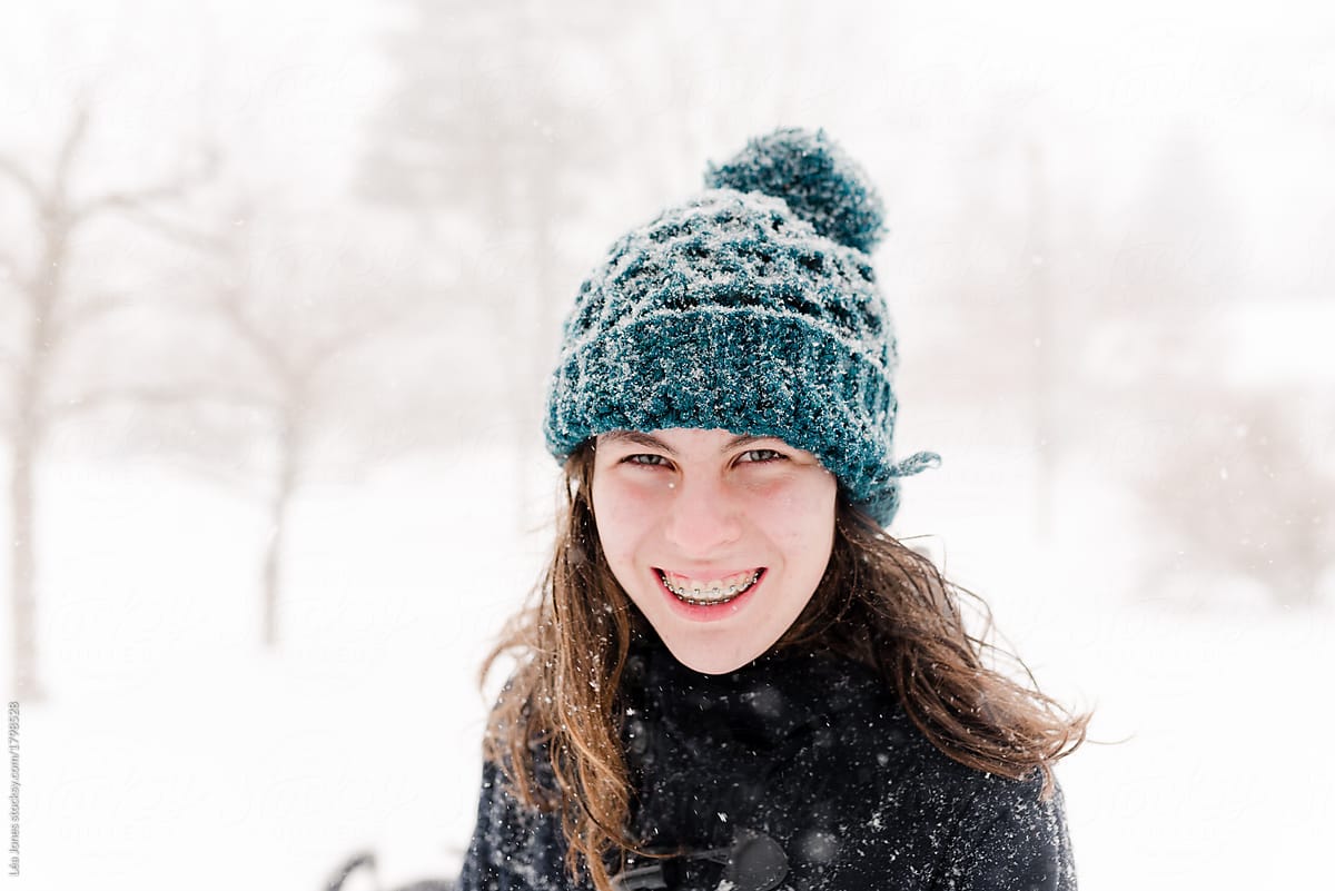 "Portrait Of Teen Girl With Wool Hat In The Snow" by Stocksy ...