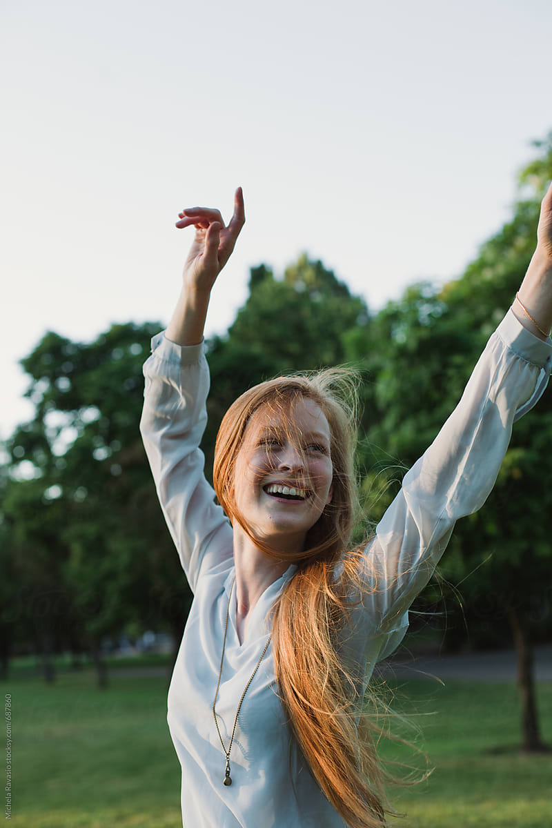 "Happy Girl Dancing In The Park" by Stocksy Contributor "Michela ...
