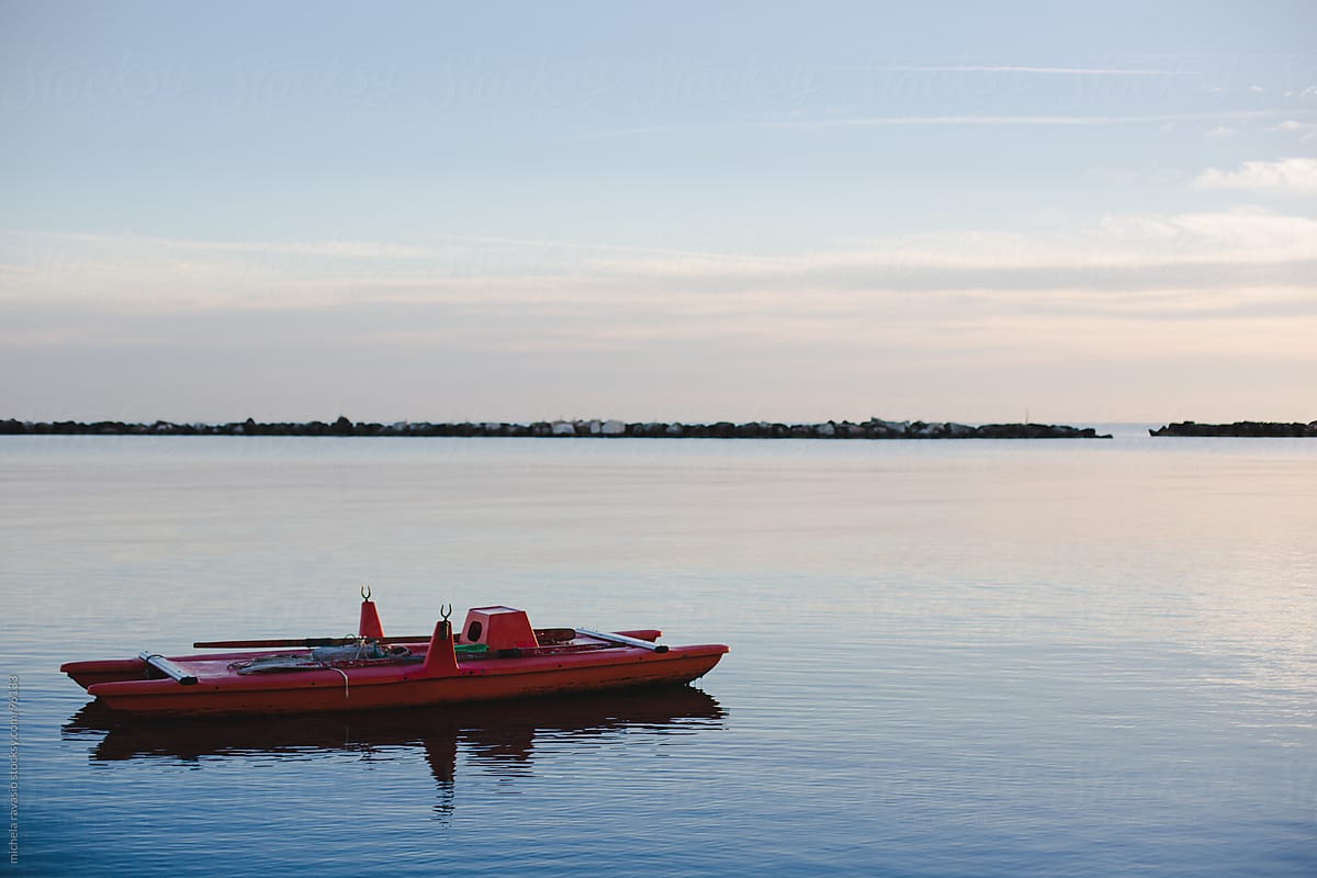 "Boat On The Sea" by Stocksy Contributor "Michela Ravasio" - Stocksy
