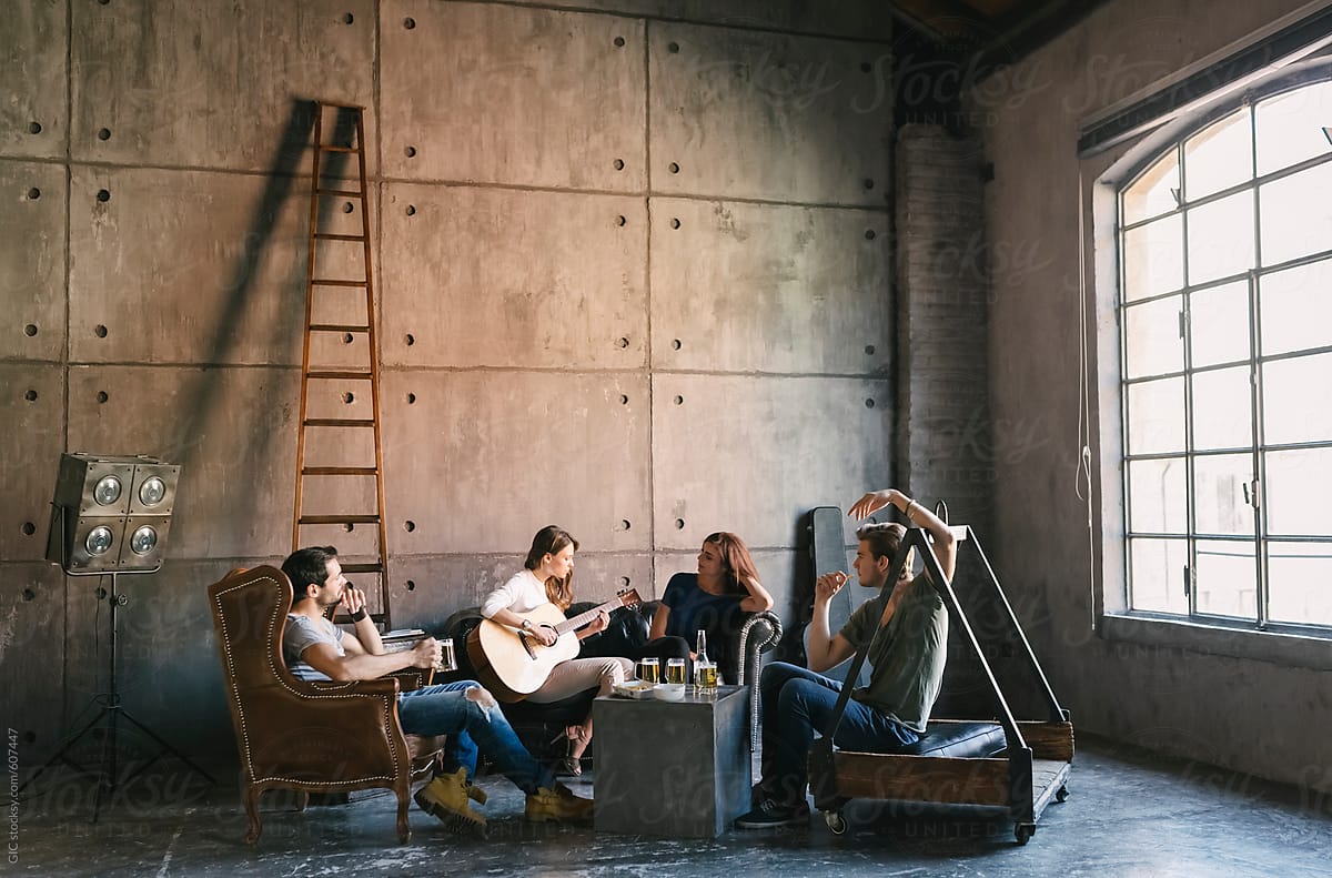 "Friends Relaxing At Home" by Stocksy Contributor "Koganami Studio ...