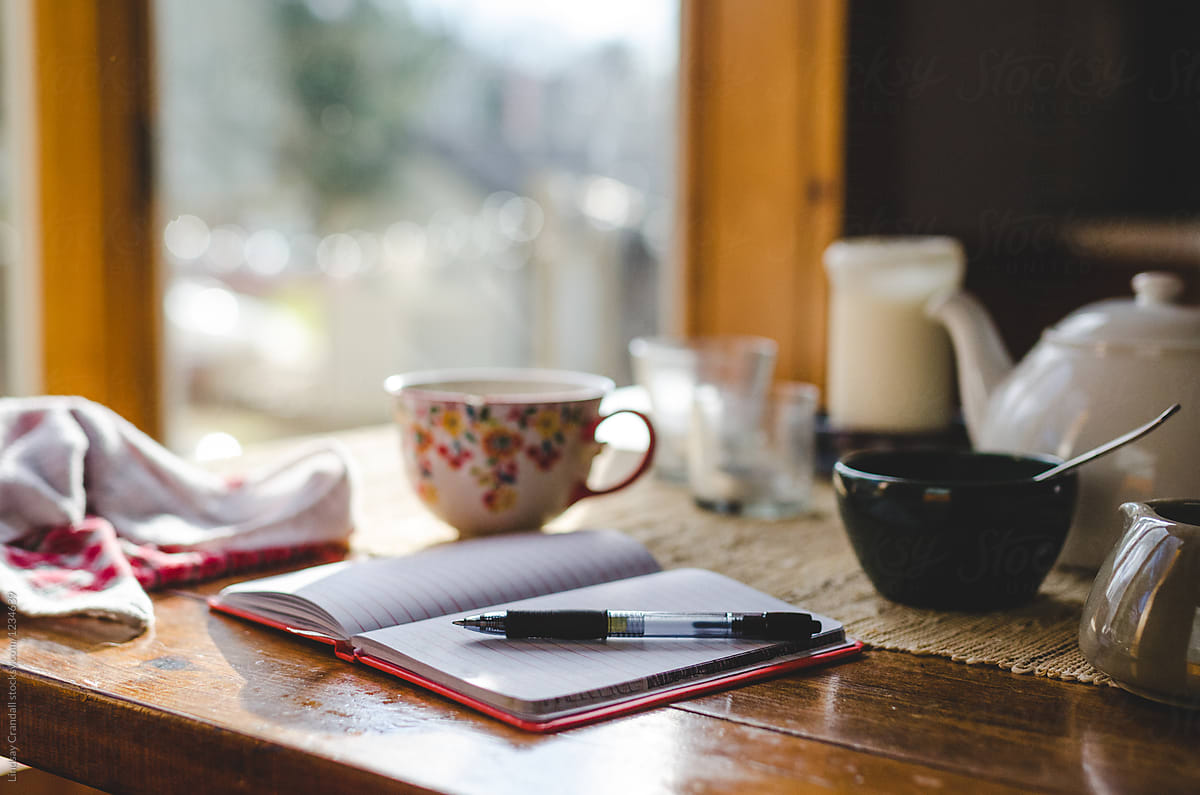 "Teacup And Open Journal On A Tabletop" by Stocksy Contributor "Lindsay ...