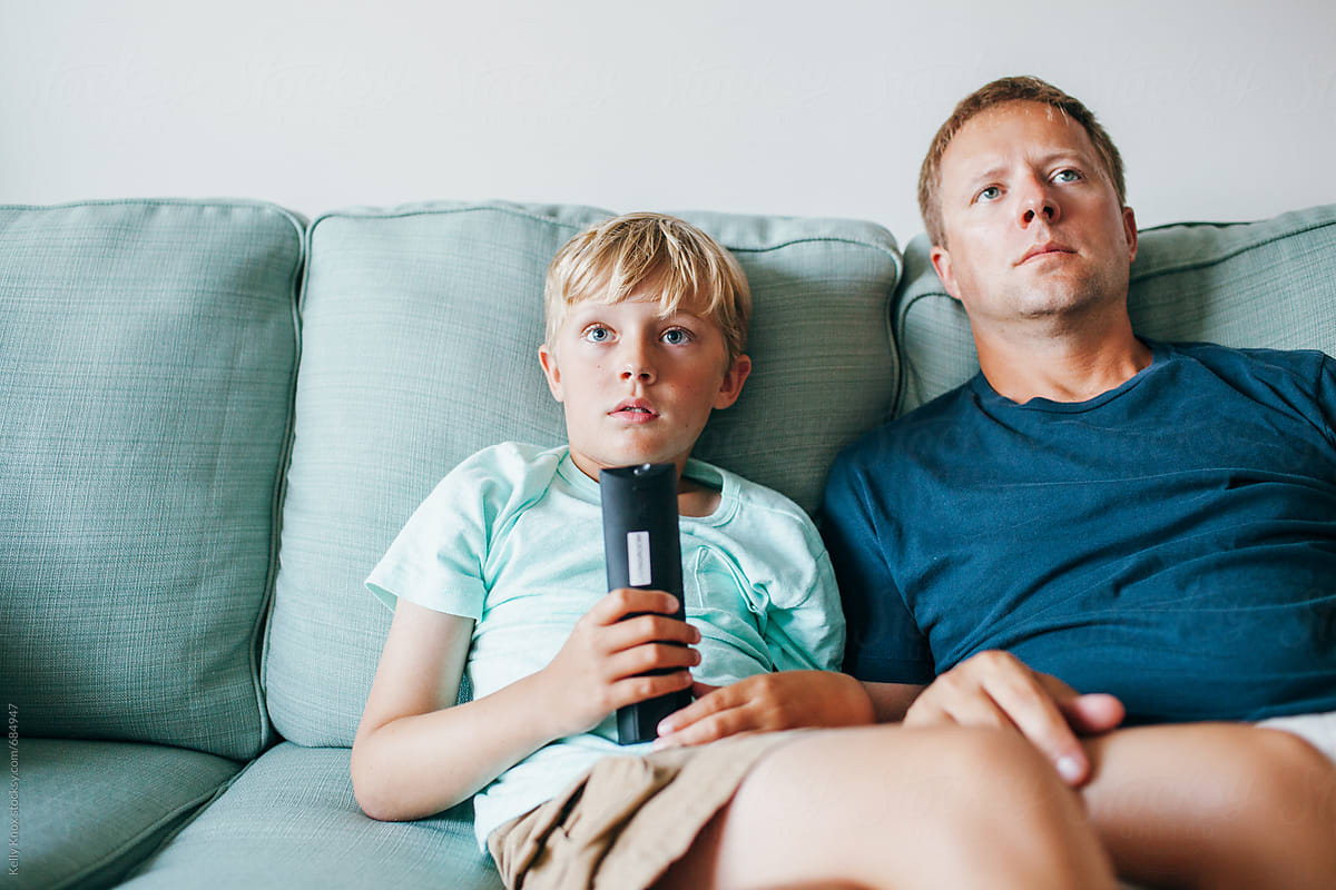 "Mesmerized Child And Father Watching Tv" by Stocksy Contributor "Kelly ...