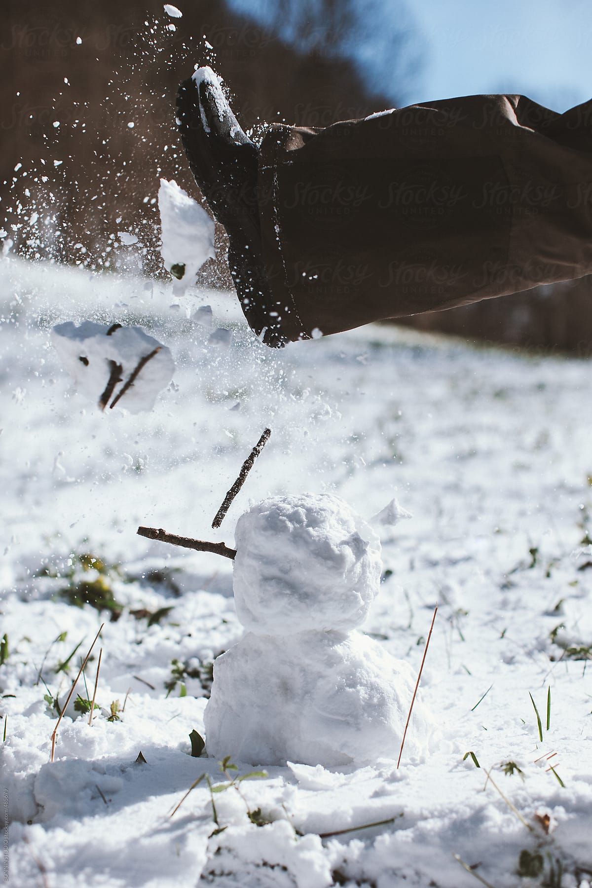 "Woman's Foot Kicking A Simple Snowman On Snowy Grass." by Stocksy ...