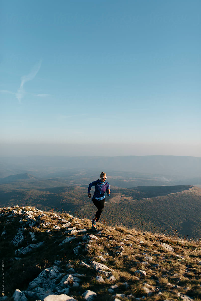 "Woman Runner In Nature" by Stocksy Contributor "Brat Co" - Stocksy