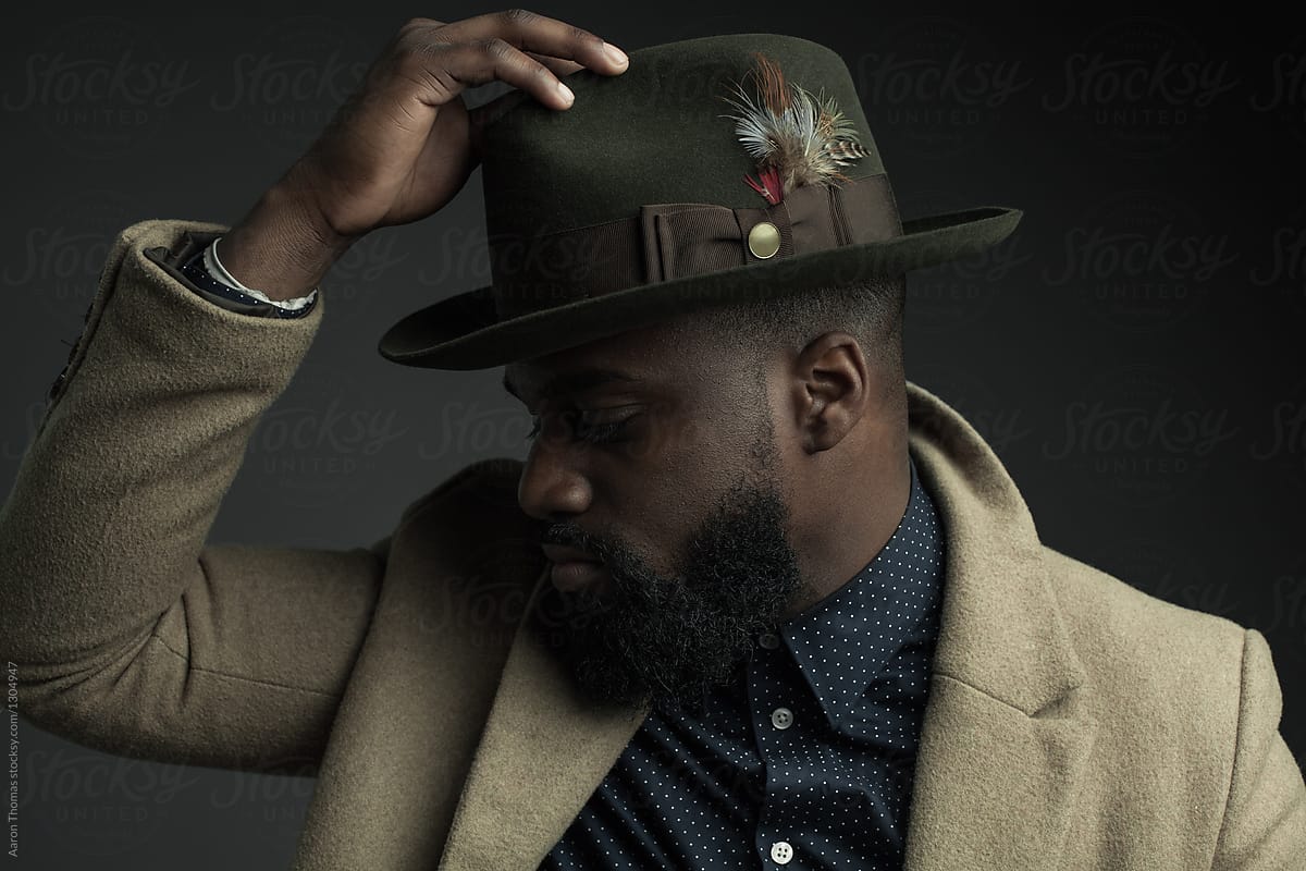 "Fashionable Man In Hat" by Stocksy Contributor "Aaron Thomas" - Stocksy