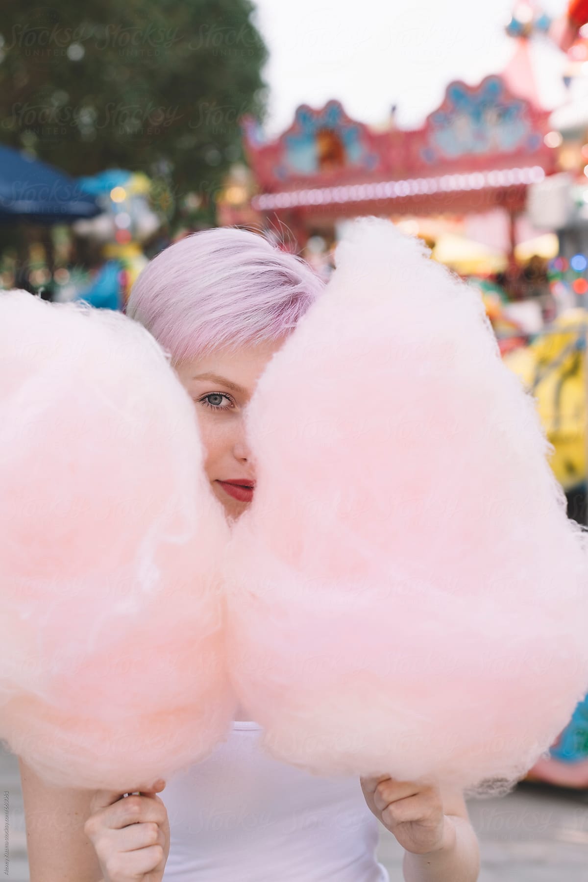 "Happy Young Woman With Cotton Candy" by Stocksy Contributor "Alexey ...