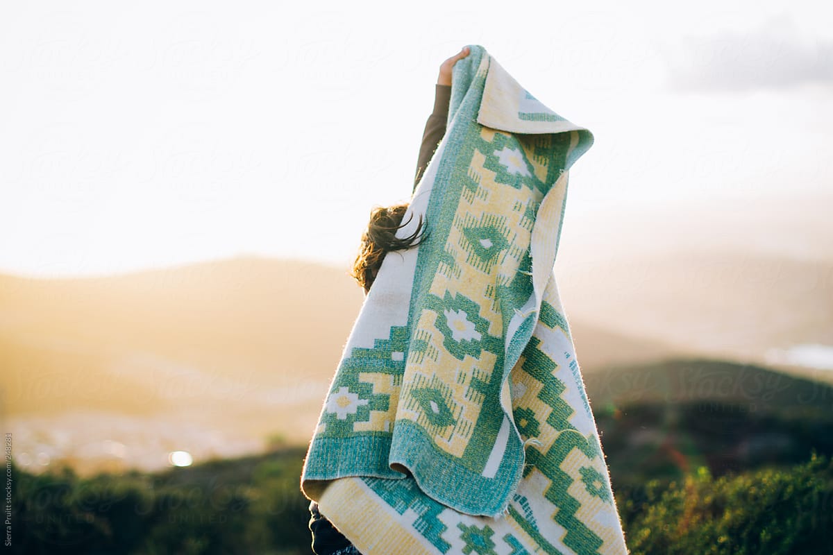 "Blanket In The Sunset" by Stocksy Contributor "Sierra Pruitt" - Stocksy