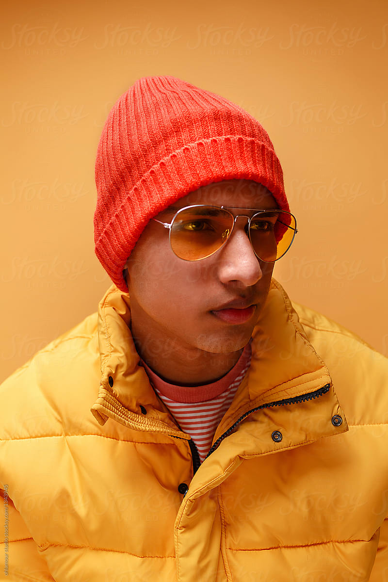 "Young Man Portraits In Orange" by Stocksy Contributor "Leandro Crespi ...