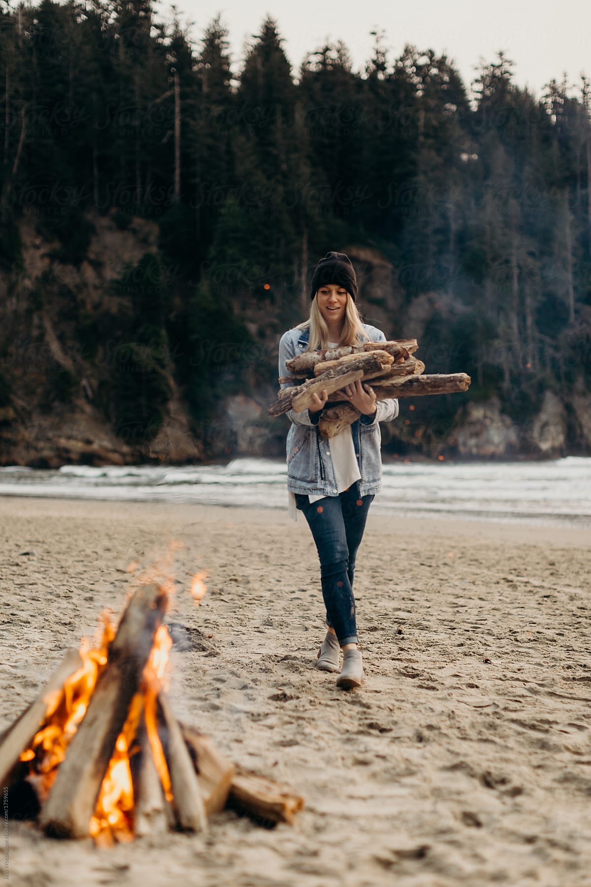 "Woman Carrying Firewood On The Beach" by Stocksy Contributor "Jess ...