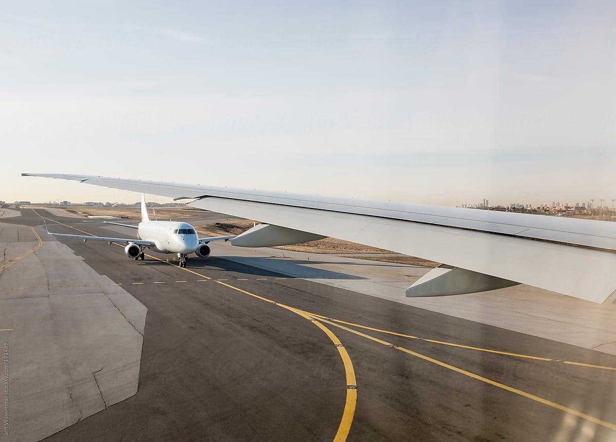 "Wing View Of Aircraft On Runway" by Stocksy Contributor "Jeff ...