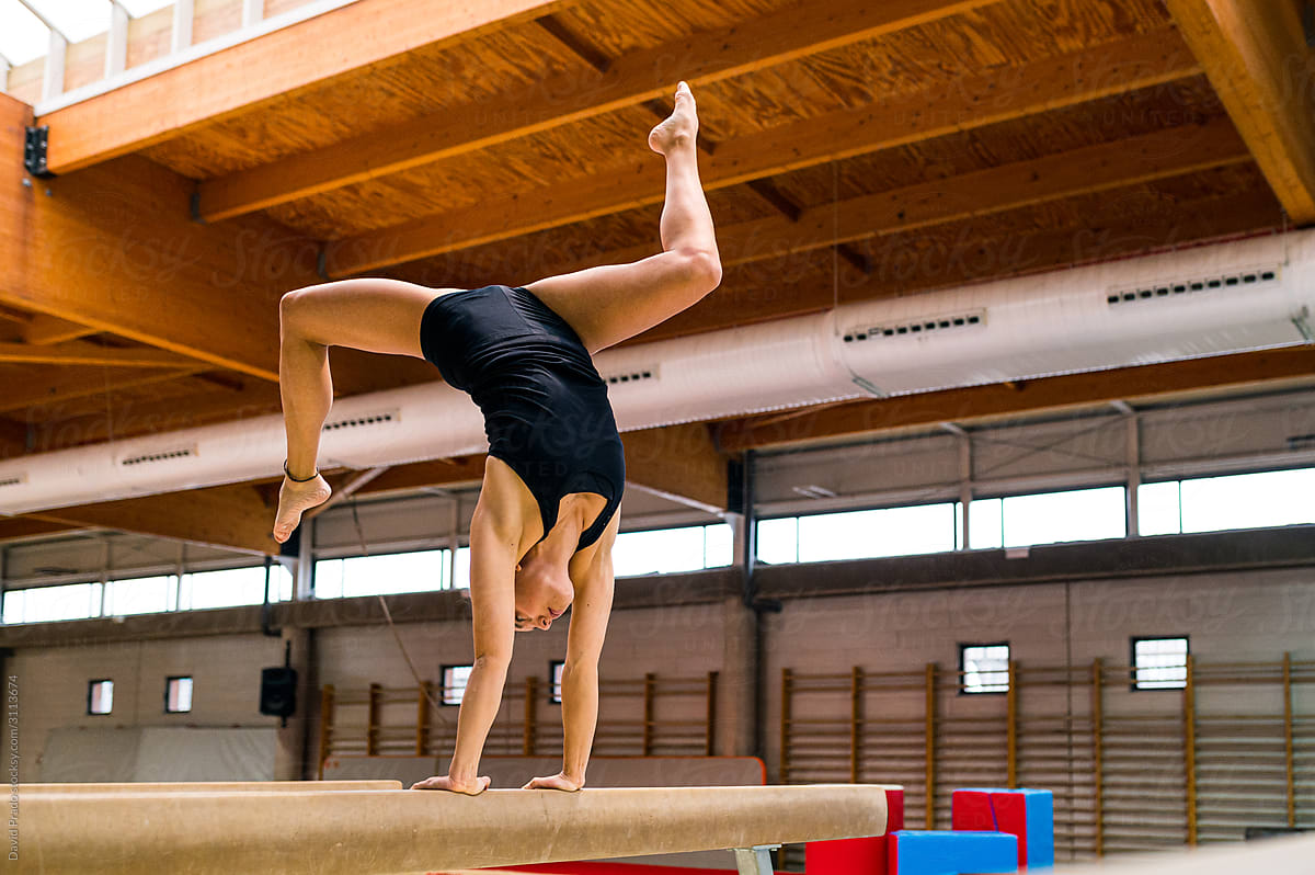 young artistic gymnast woman performing and training - Stock Image ...